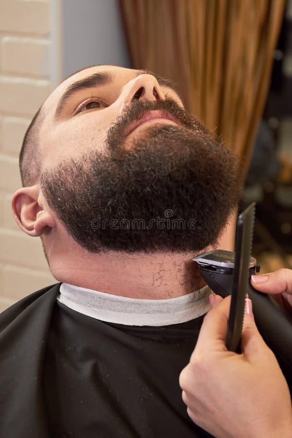 Beard Trimming in Barber Shop. Stock Photo - Image of machine, people ...