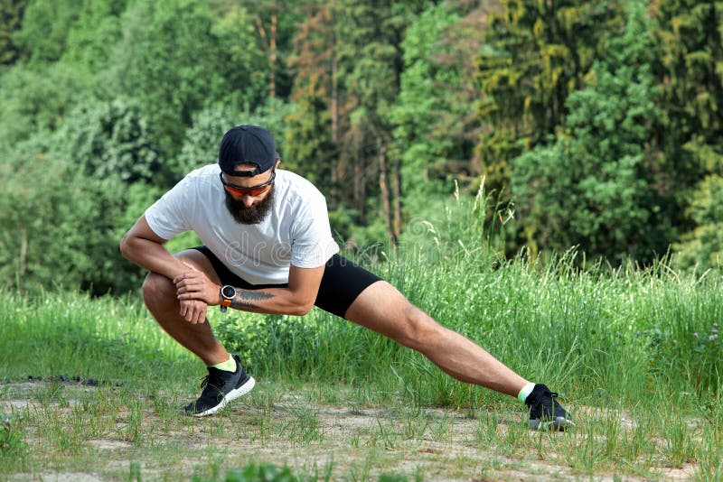 Bearded Athletic Man Doing Workout Exercise in the Outdoor Gym in ...
