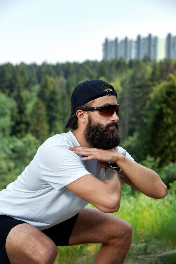 Bearded Athletic Man Doing Workout Exercise in the Outdoor Gym in ...