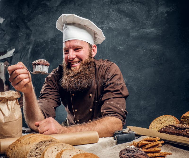 Bearded Baker Happy with His Work, Looking at His Freshly Made Muffin ...