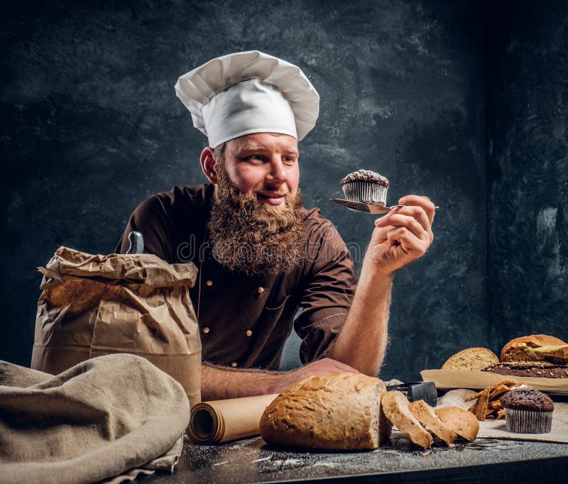 Bearded Baker Happy with His Work, Looking at His Freshly Made Muffin ...