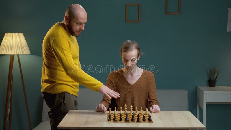 Bearded Bald Caucasian Man Teaching Young Guy Playing Chess Explaining ...