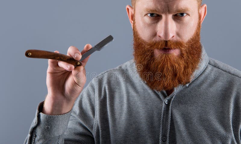 Bearded Barber Man Shaving with Blade. Man in Barber Studio. Man Hold ...