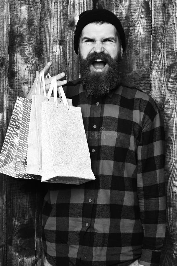 Bearded Brutal Caucasian Hipster with Moustache Holding Shopping ... Bearded Brutal Caucasian Hipster with Moustache Holding Shopping ...