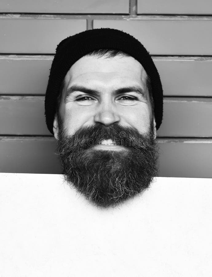 Bearded Brutal Caucasian Hipster with White Paper Sheet Stock Image ... Bearded Brutal Caucasian Hipster with White Paper Sheet Stock Image ...