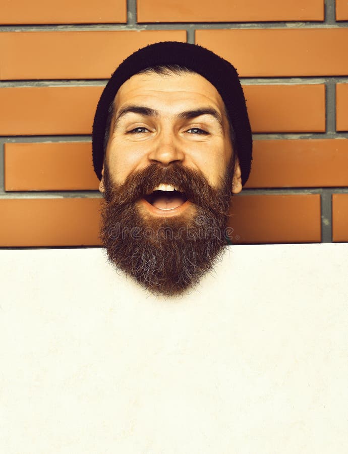 Bearded Brutal Caucasian Hipster with White Paper Sheet Stock Image ... Bearded Brutal Caucasian Hipster with White Paper Sheet Stock Image ...
