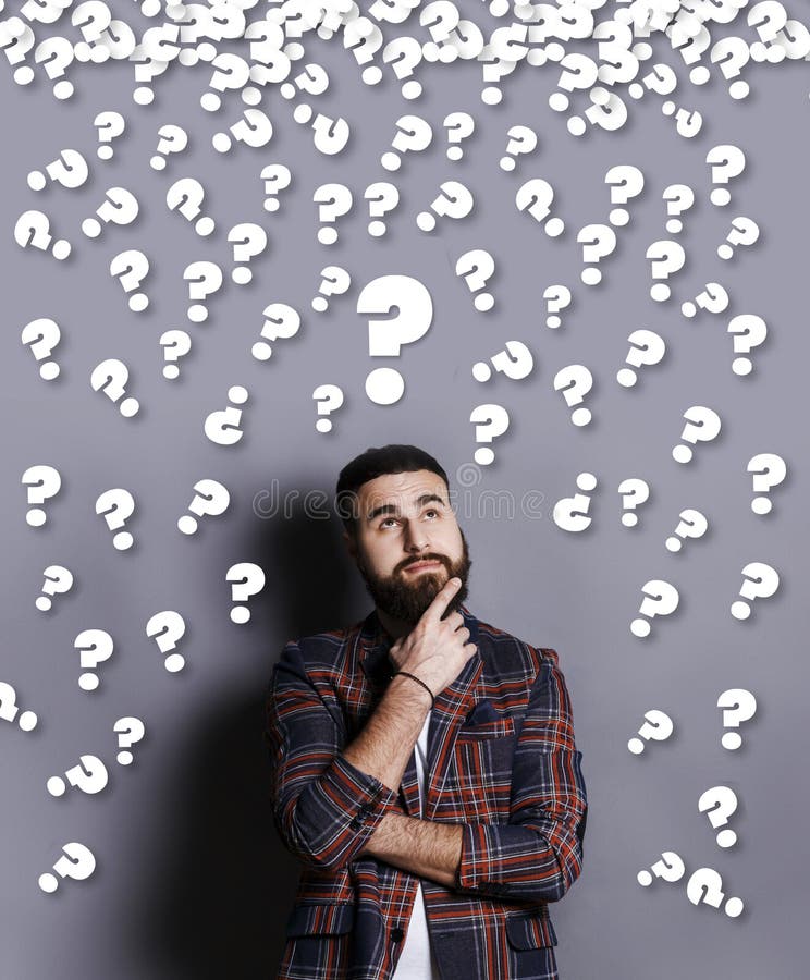 Bearded Caucasian Guy Looking Up and Thinking Over Grey Background with ...