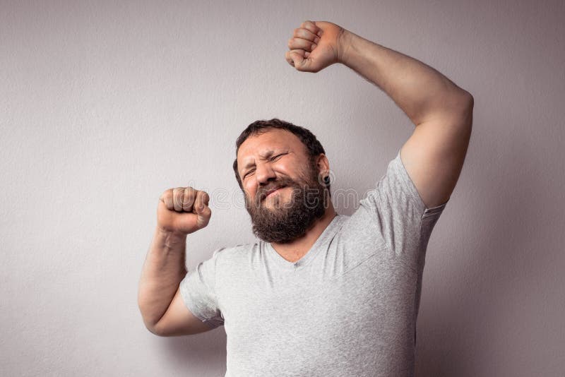 Bearded Caucasian Man With An Exhausted Face Expression Stretching His ...