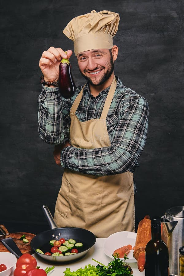 Bearded Chef Cook Holds Eggplant. Stock Photo - Image of emotions ...