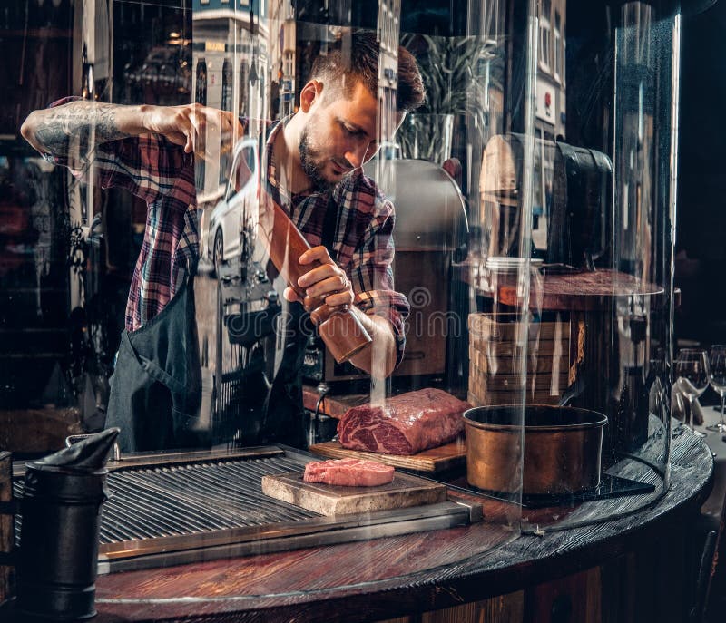 Chef Cooking Delicious Beef Steak on a Kitchen, Standing Behind ...