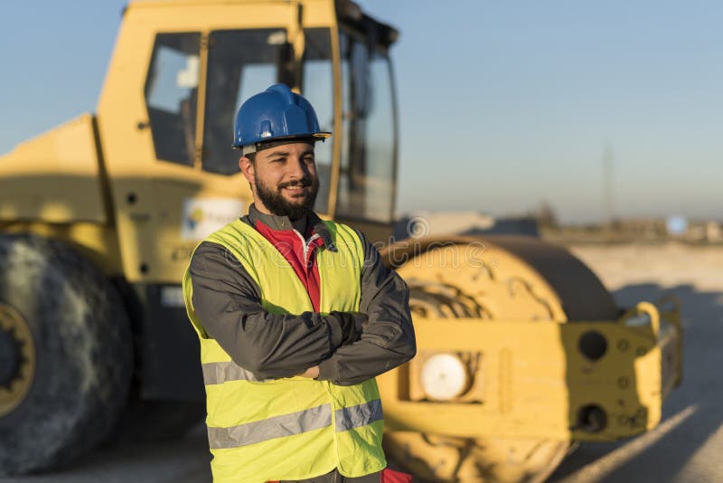 Bearded Construction Worker in Reflective Vest and Hardhat Leaning on ...