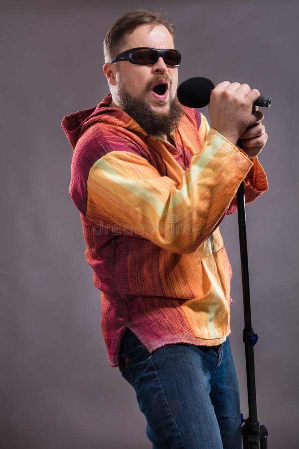 Bearded Emotional Rock Singer with Microphone Studio Portrait. Stock ...