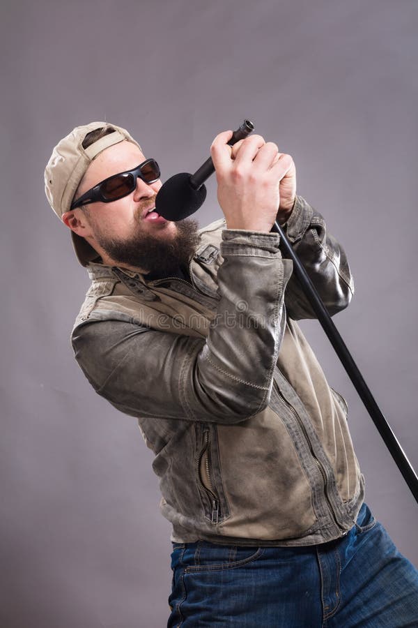 Bearded Emotional Rock Singer with Microphone Studio Portrait. Stock ...