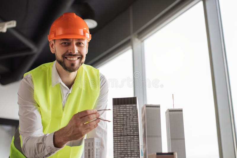 Bearded Engineer in Protective Helmet Working on Building Complex ...
