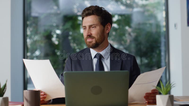 Bearded Entrepreneur Looking Documents Feeling Satisfied at Workplace ...