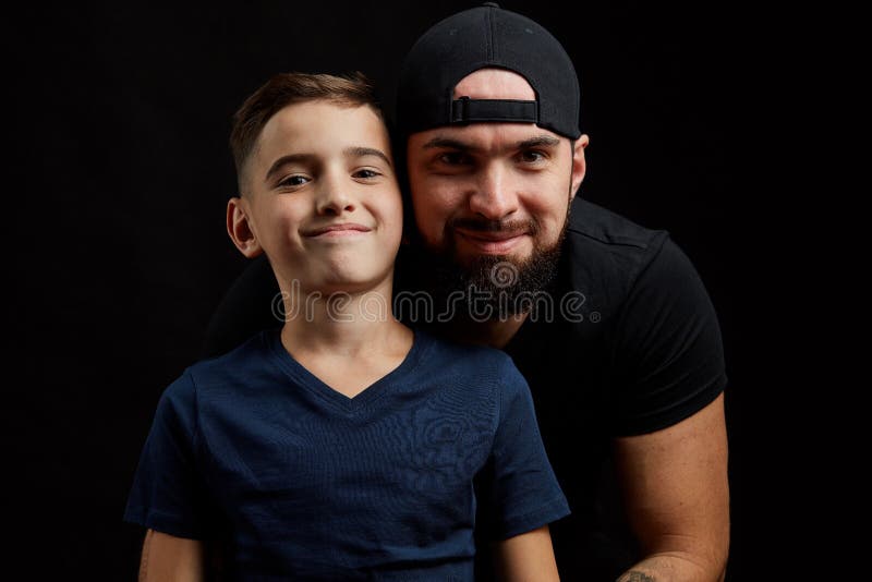 Bearded Father and Little Son Smile for Camera on Black Background ...