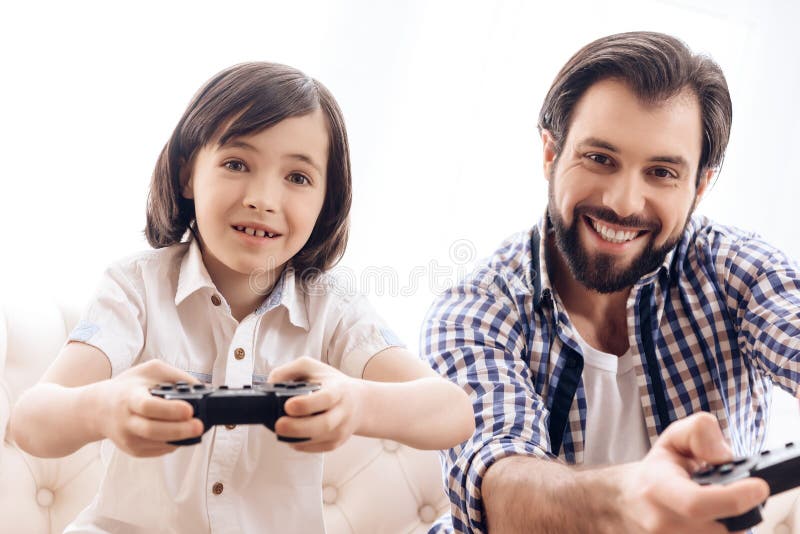 Bearded Father with Son Plays Computer Game Using Game Controllers ...