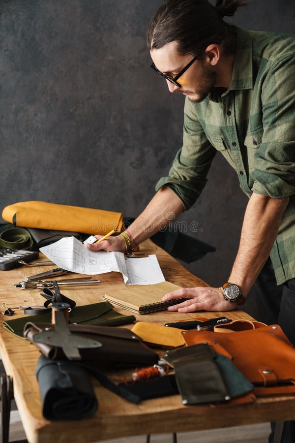Bearded Focused Craftsman Working with Leather while Standing at Table ...