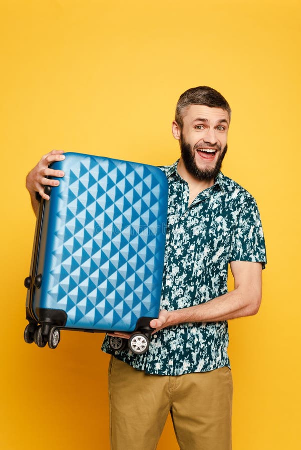 Bearded Guy with Blue Suitcase on Yellow Stock Photo - Image of ...