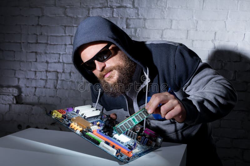 Bearded Hacker in Sunglasses and Hoodie Cracking the Hardware Stock ...