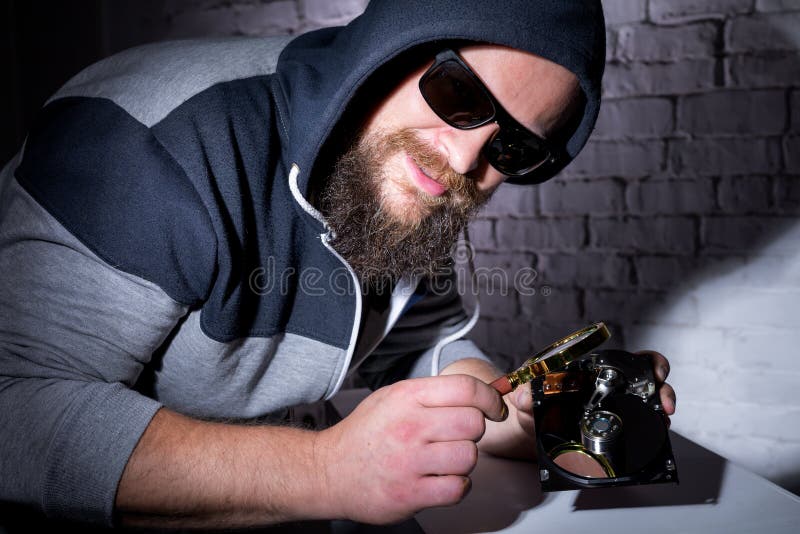 Bearded Hacker in Sunglasses and Hoodie Cracking the Hardware Stock ...
