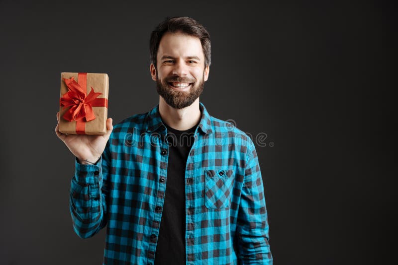 Bearded Happy Man Smiling while Showing Gift Box Stock Photo - Image of ...