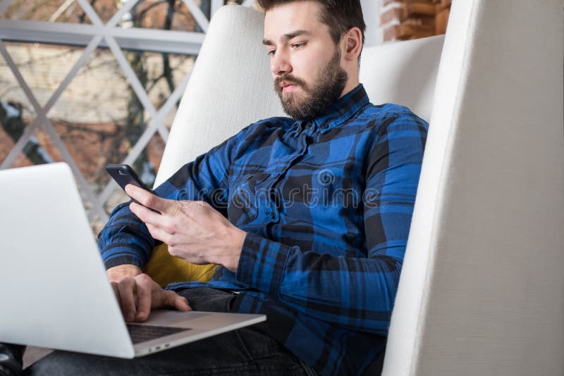 Businessman Reading Notification on Mobile Phone during Webinar on ...