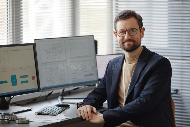 Bearded Male Engineer at Workplace in Office Looking at Camera Smiling ...