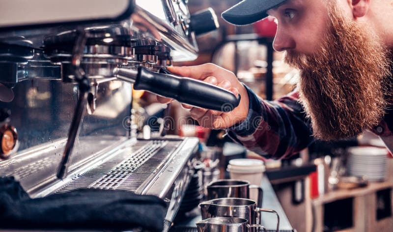 A Man is Making Coffee in a Professional Coffee Machine. Stock Photo ...