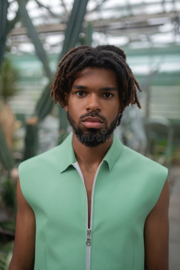 Bearded Male Model with Dreadlocks Standing in Greenhouse Stock Photo ...