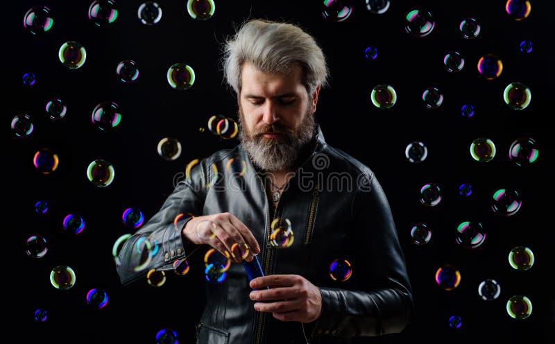Bearded Man Blowing Soap Bubbles. Handsome Guy in Leather Jacket Having ...