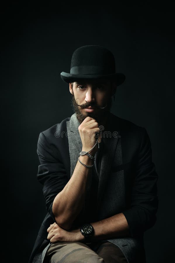 The Bearded Man in a Bowler Hat Touching His Beard Stock Image - Image ...