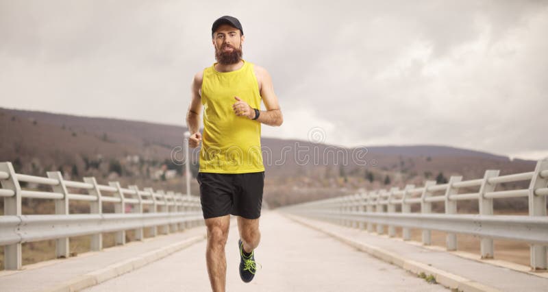 Bearded Man with a Cap Jogging Stock Photo - Image of exercise, single ...