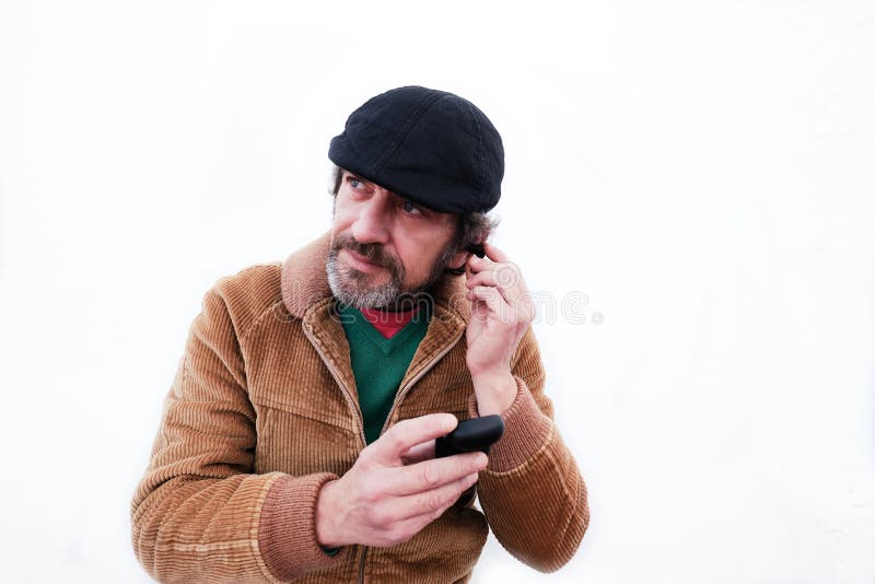 Bearded Man with Cap Putting on Black Wireless Headphones Stock Image ...