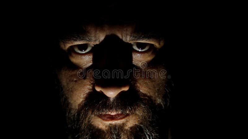 Bearded Man in the Dark Looking at the Camera. Stock Photo - Image of ...
