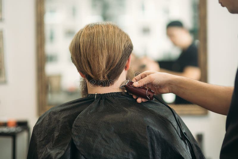 Bearded Man Having a Haircut with a Hair Clippers. Back View Stock ...