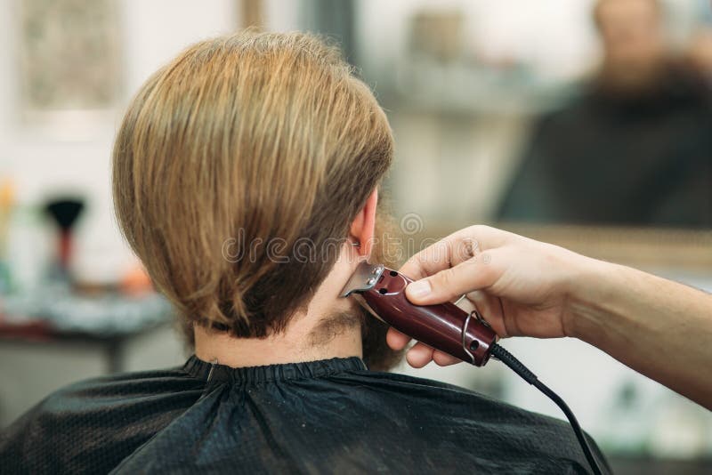 Bearded Man Having a Haircut with a Hair Clippers. Back View Stock ...