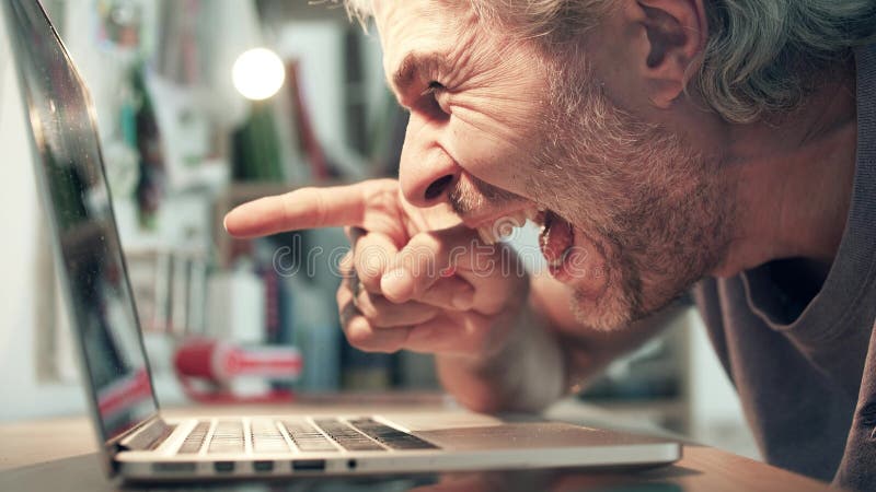 A Bearded Man Laughs Out Loud when Using His Laptop Stock Image - Image ...