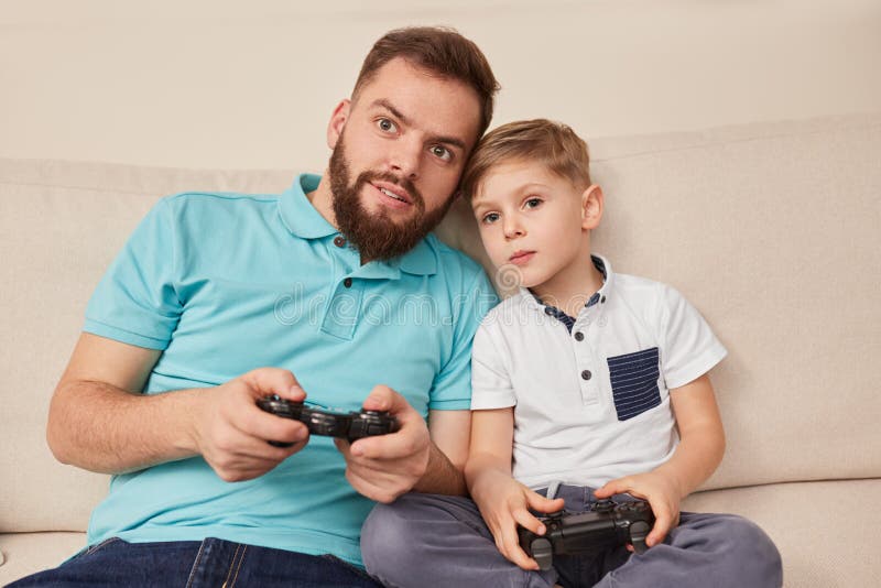 Father And Son Playing Videogame Together Stock Image Image Of
