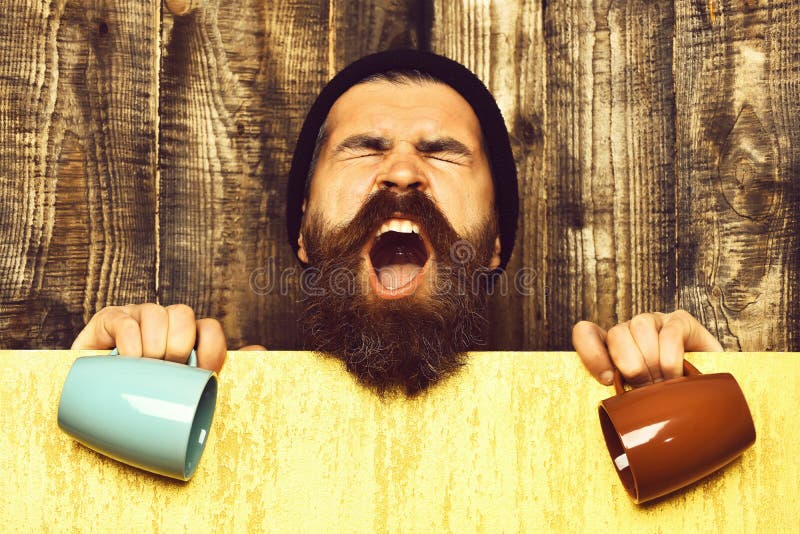 Bearded Brutal Caucasian Hipster with Paper Sheet and Cups Stock Image ... Bearded Brutal Caucasian Hipster with Paper Sheet and Cups Stock Image ...