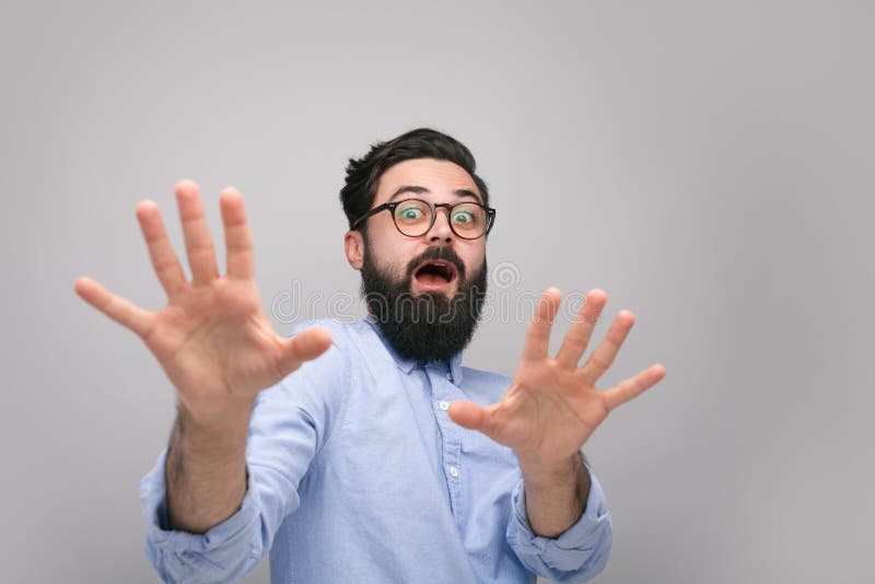 Scared Man Gesturing with Hands on Gray Stock Image - Image of formal ...