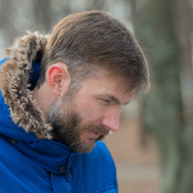 Bearded Man Looks Down. Bearded Man. Portrait Man. Looking. in the City ...