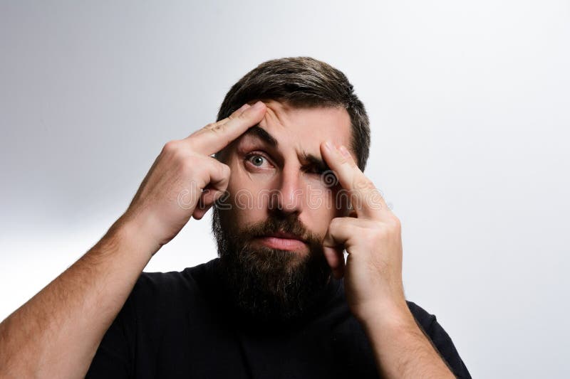 Man Pointing at His Forehead with a Concerned Expression. Stock Photo ...