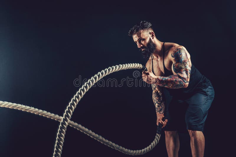 Men with Rope in Functional Training. Studio Shot, Isolate Stock Photo ...