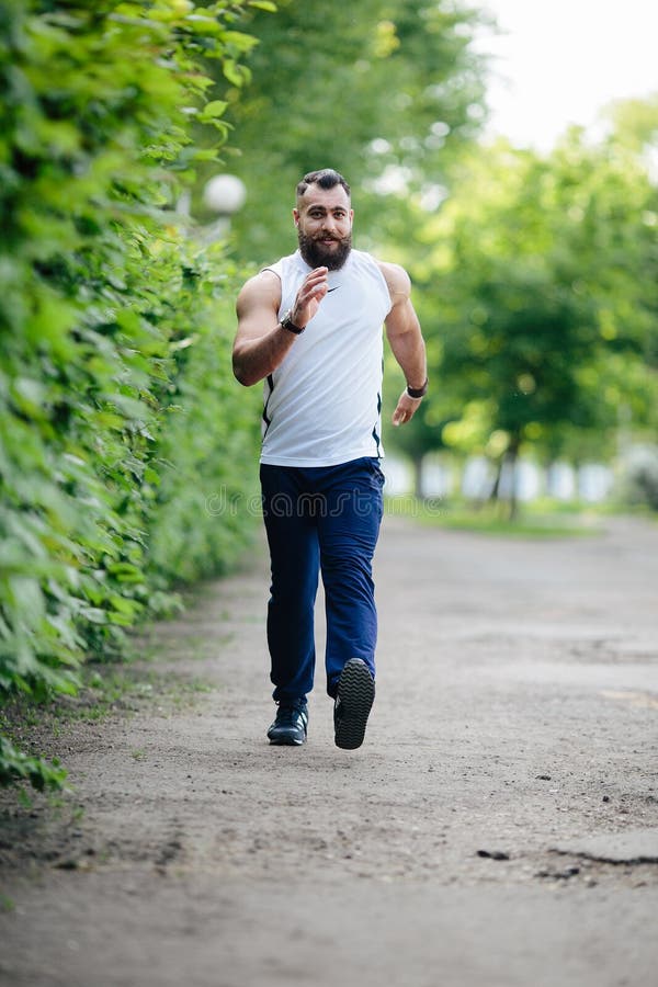 Bearded man runs stock photo. Image of moving, fitness - 57985428