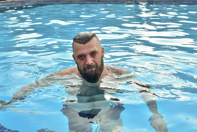 Bearded Man Swimming in a Pool. Man with a Beard in the Pool Stock ...