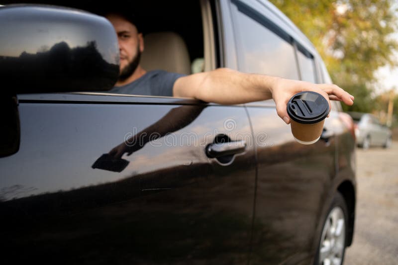 Bearded Man Throws Waste from the Car a Coffee Cup. Environmental ...