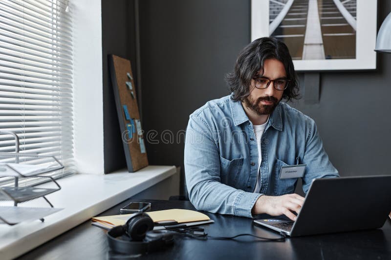 Bearded Man Using Computer Working at Desk in Office Interior in Dark ...