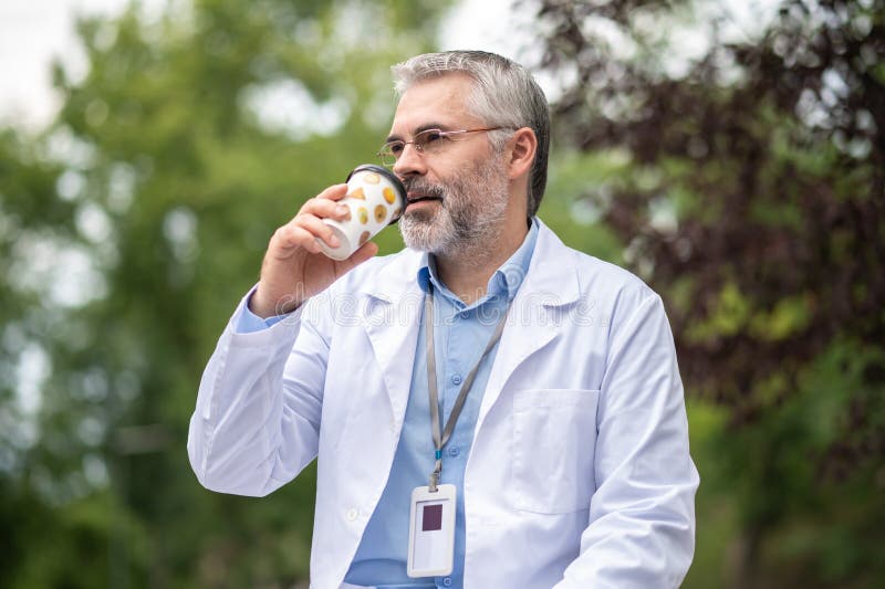 Bearded Mature Man in Na Lab Coat with a Cup of Coffee Stock Image ...