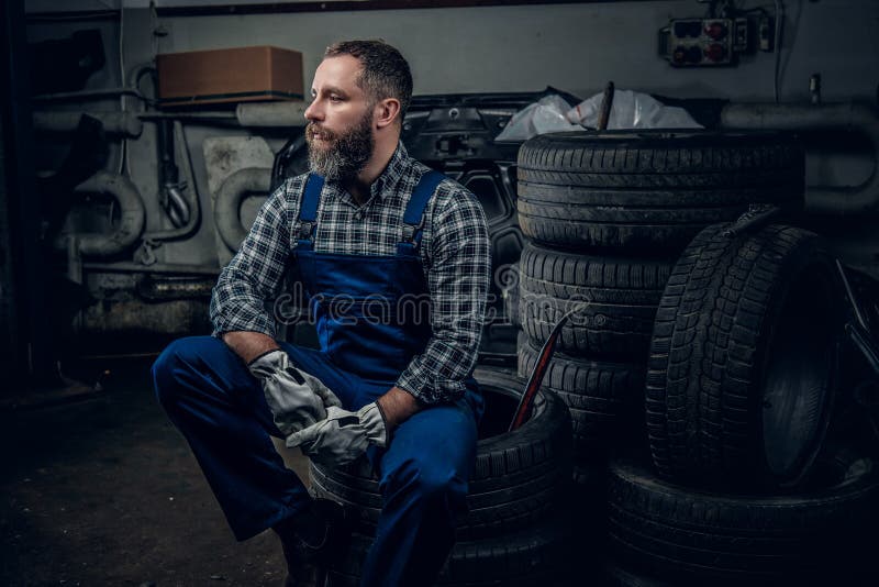 A man in a garage stock image. Image of repair, service - 109909593